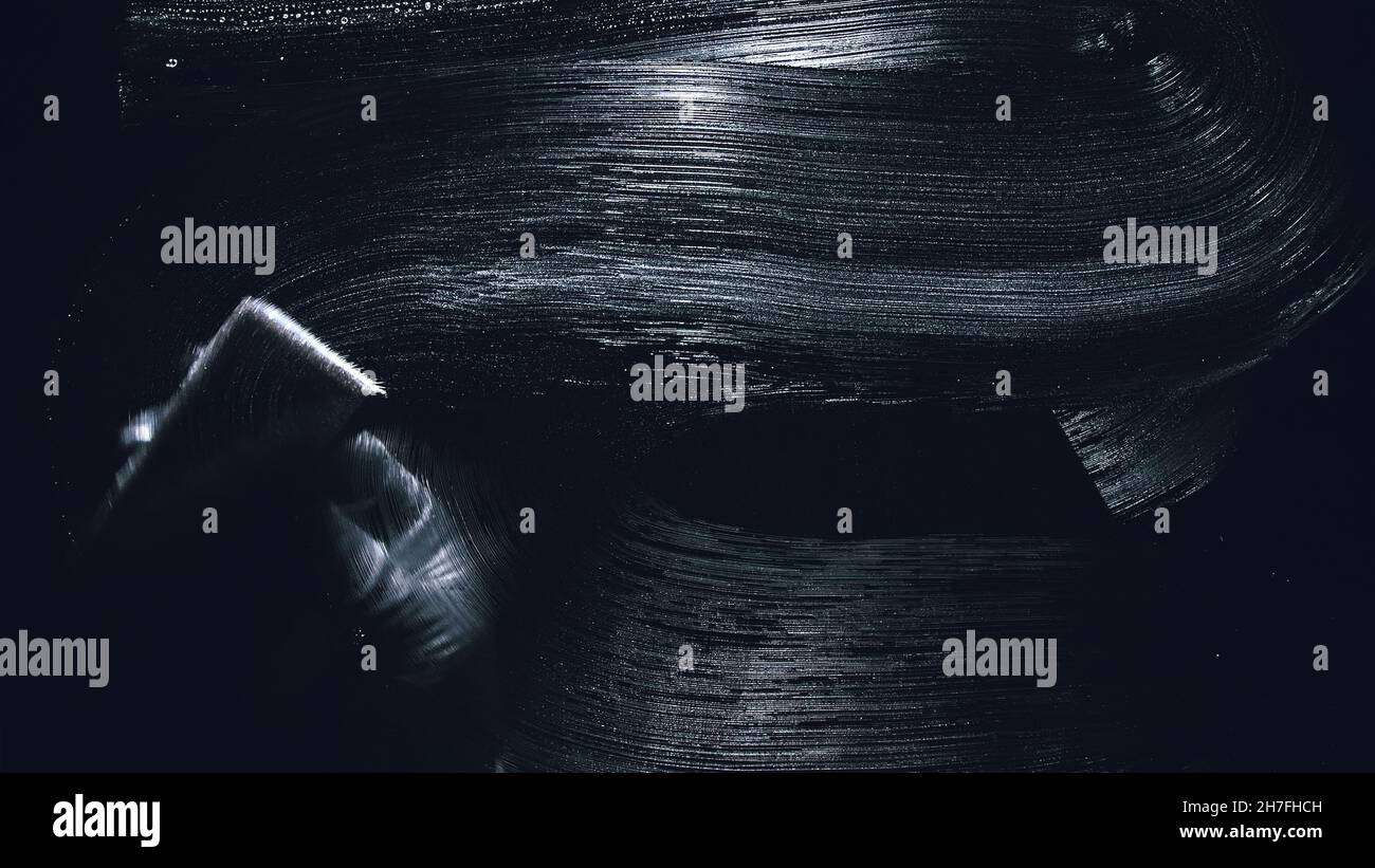 Internal view from inside of the glass a car while being car wash ...