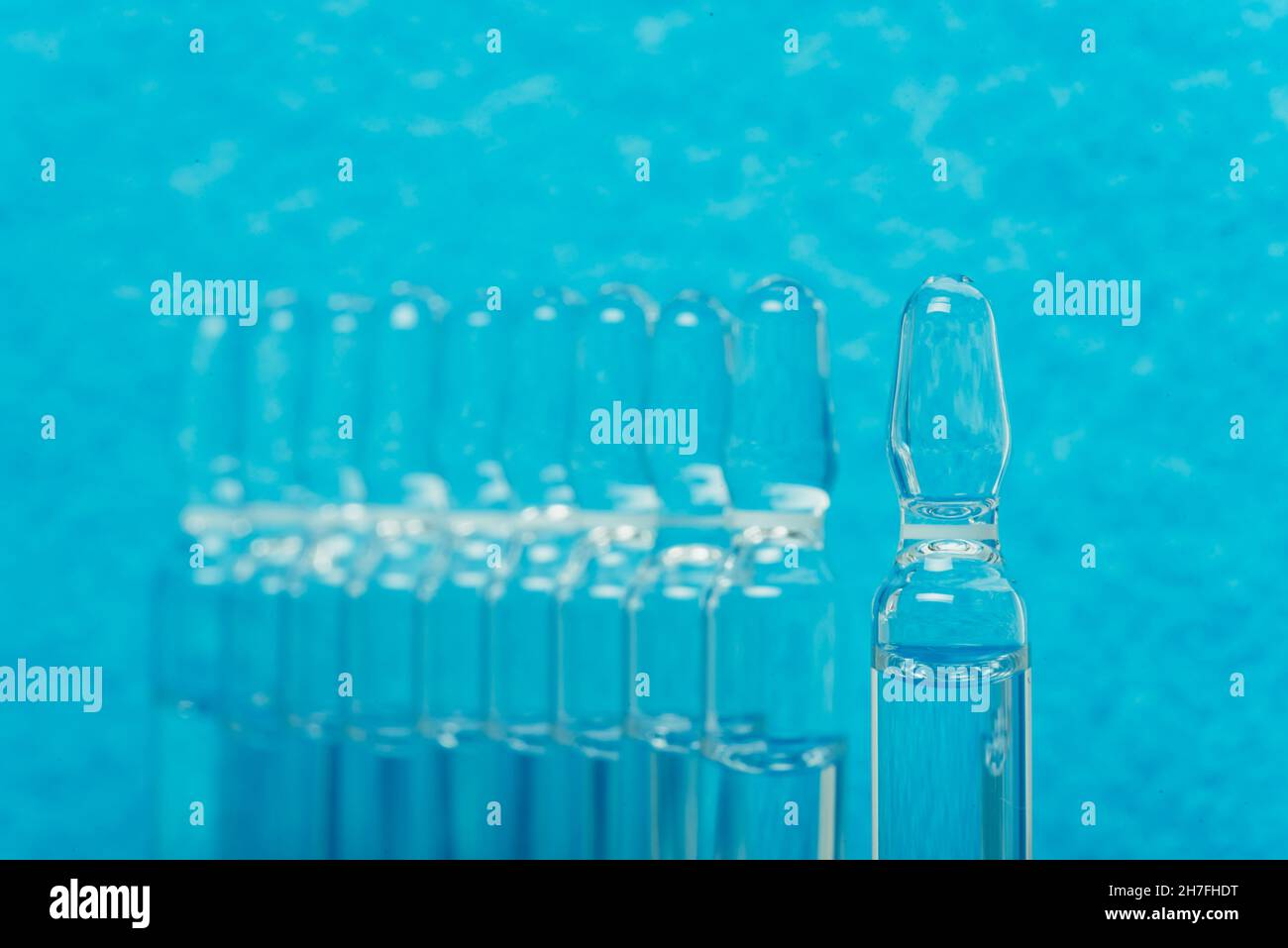 Glass medical ampoule vial for injection. Medicine is liquid sodium ...