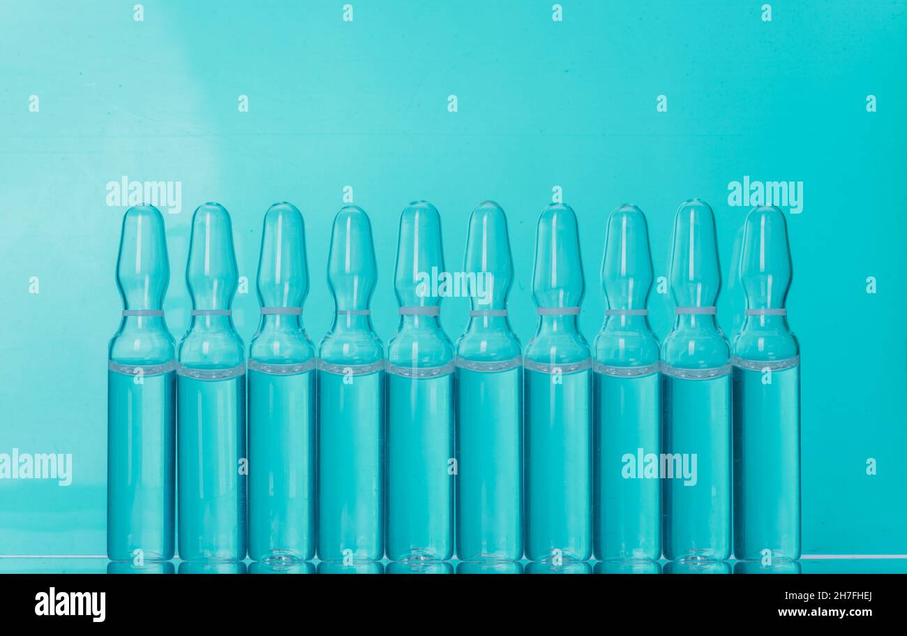 Glass medical ampoule vial for injection. Medicine is liquid sodium ...