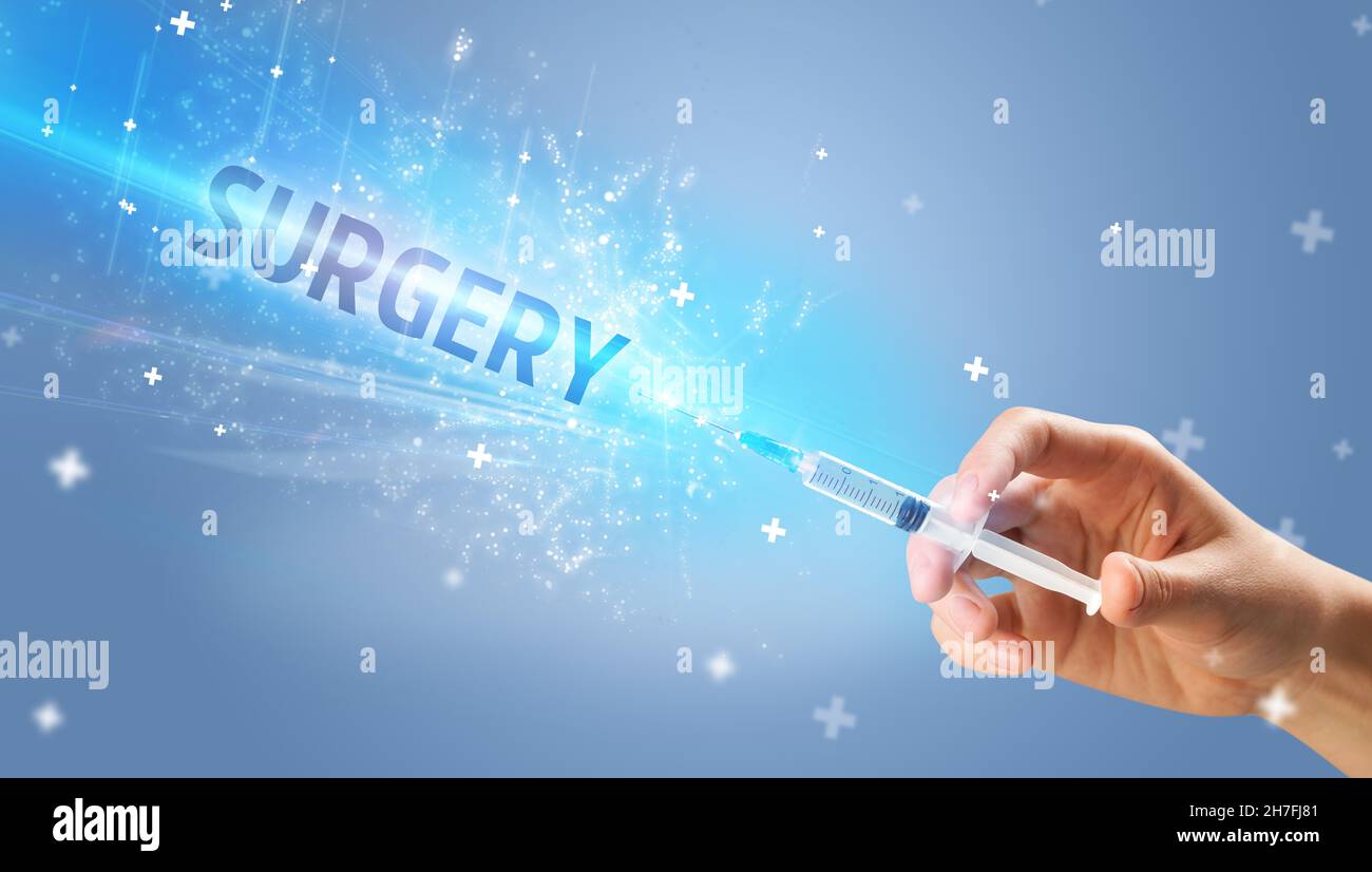 Syringe, medical injection in hand Stock Photo - Alamy