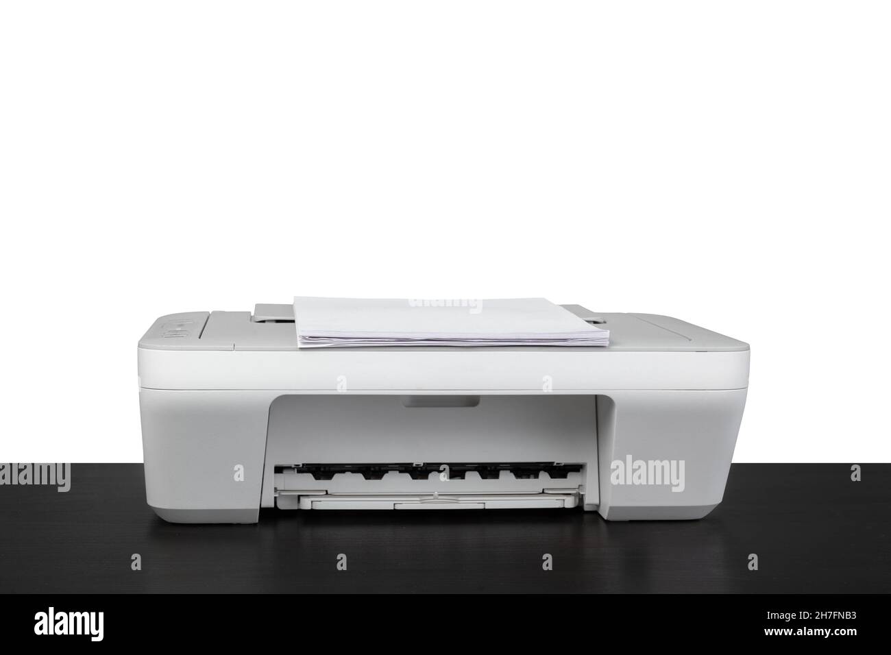 Laser home printer on table against white backgorund Stock Photo - Alamy