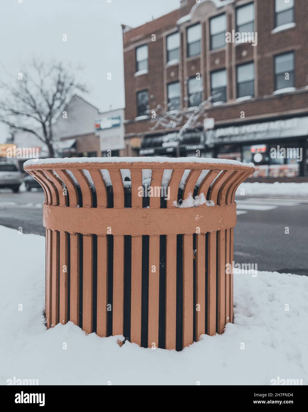Garbage bin covered in snow Stock Photo - Alamy
