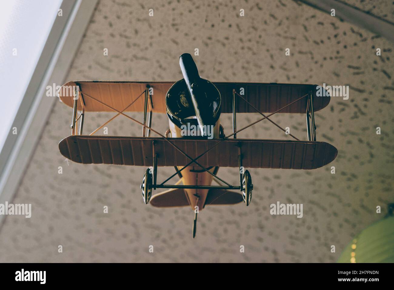Old airplane model hanging on a ceiling Stock Photo - Alamy