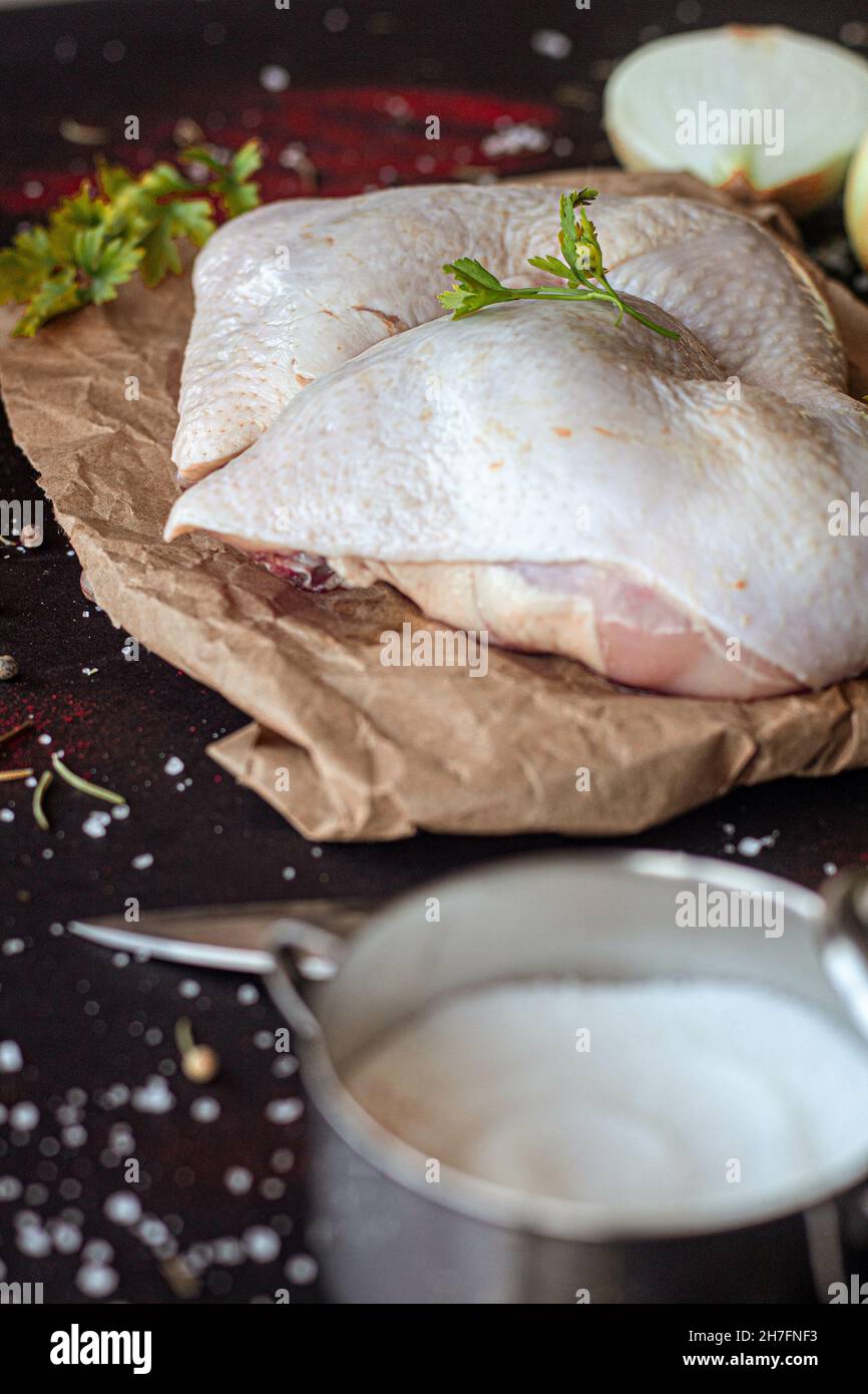 Vertical shot of chicken meat on a board in a kitchen Stock Photo - Alamy