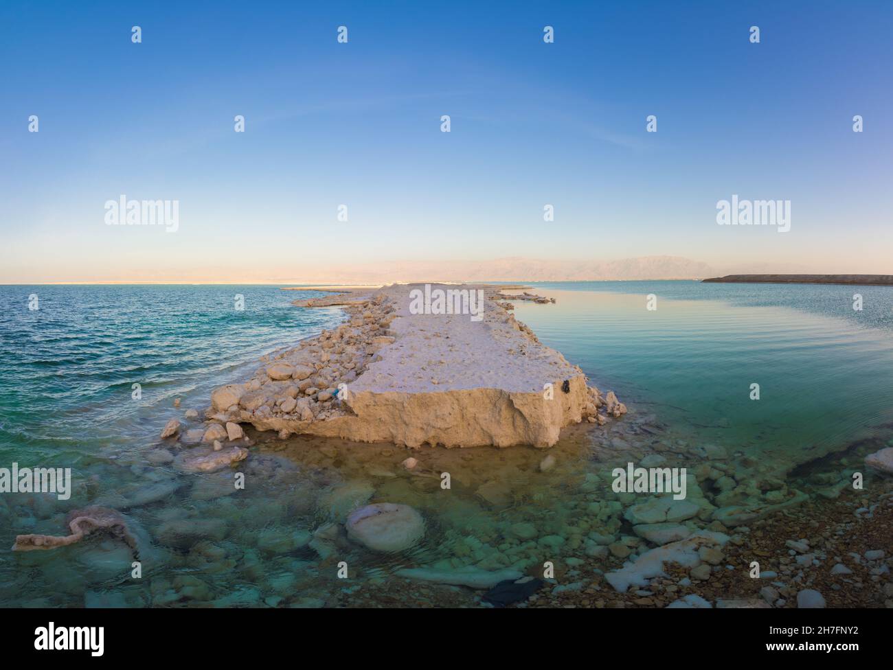 Huge lumps of salt in the Dead Sea, on the sunset background, ein gedi ...