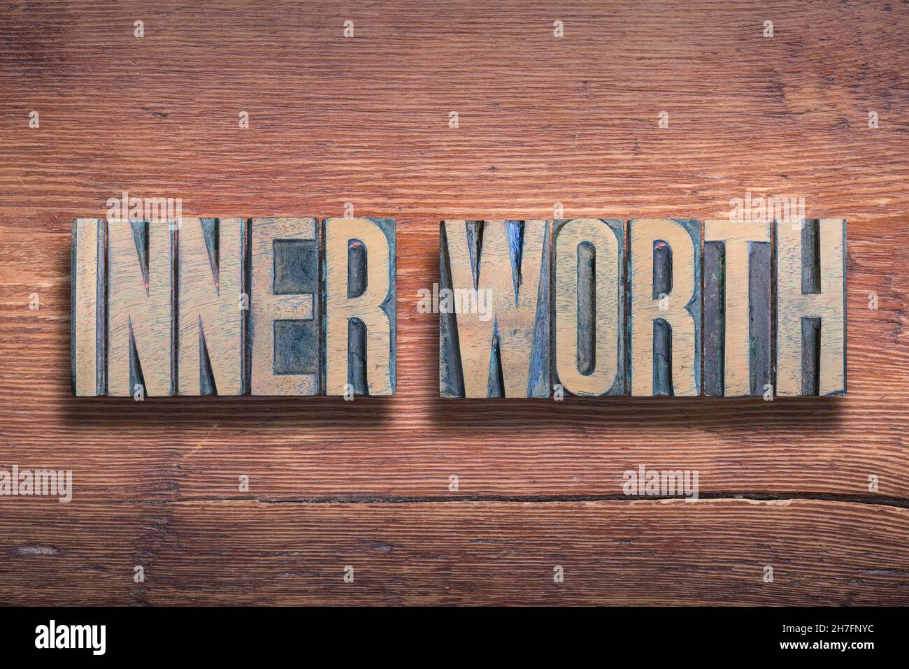 inner worth phrase combined on vintage varnished wooden surface Stock ...