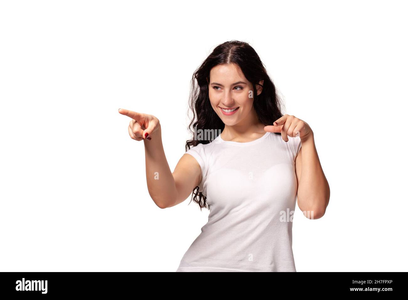 Young girl in white dress points to someone the finger Stock Photo - Alamy