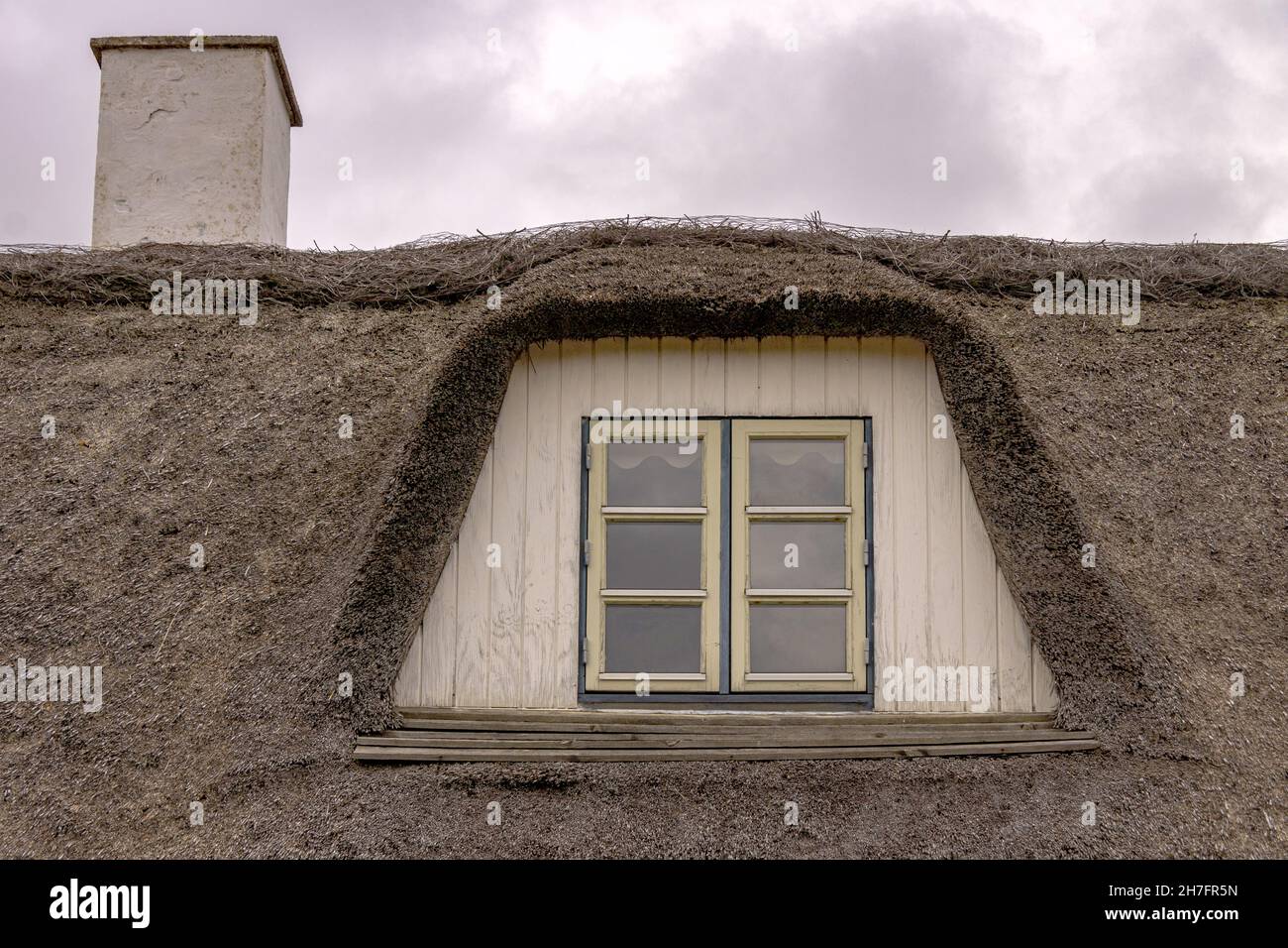 Thatched roof with bay window and chimney Stock Photo - Alamy
