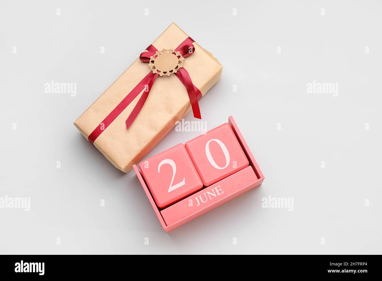 Calendar with date of June 20 and gift box on white background Stock ...