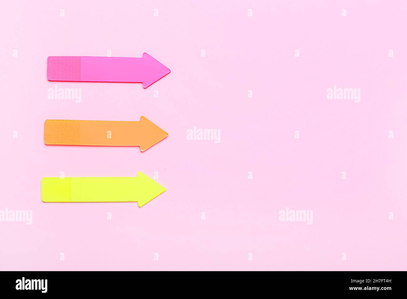 Colorful sticky notes in shape of arrows on pink background Stock Photo ...