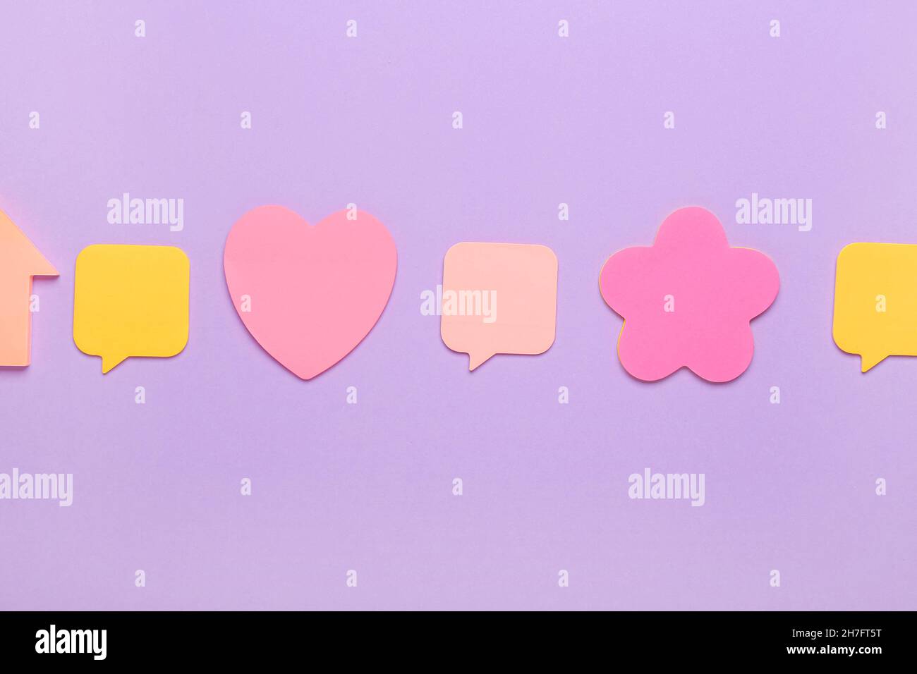 Different sticky notes on lilac background Stock Photo - Alamy