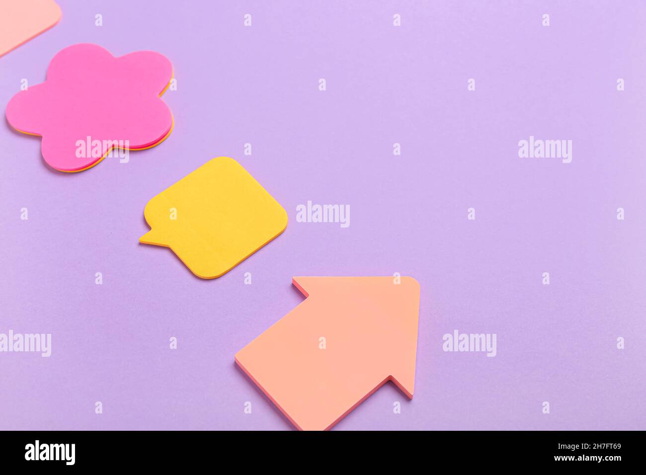 Different sticky notes on lilac background, closeup Stock Photo - Alamy
