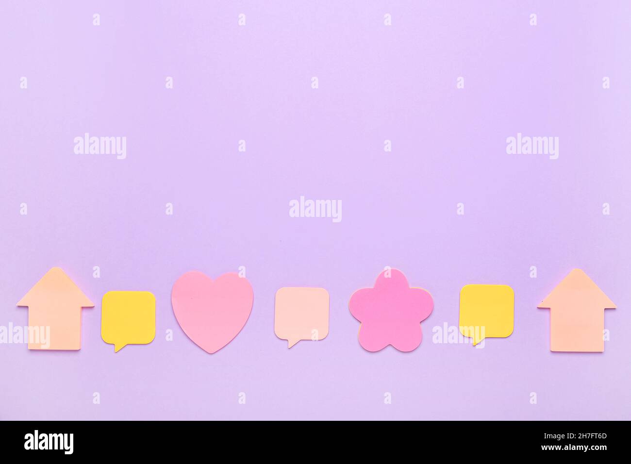 Different sticky notes on lilac background Stock Photo - Alamy