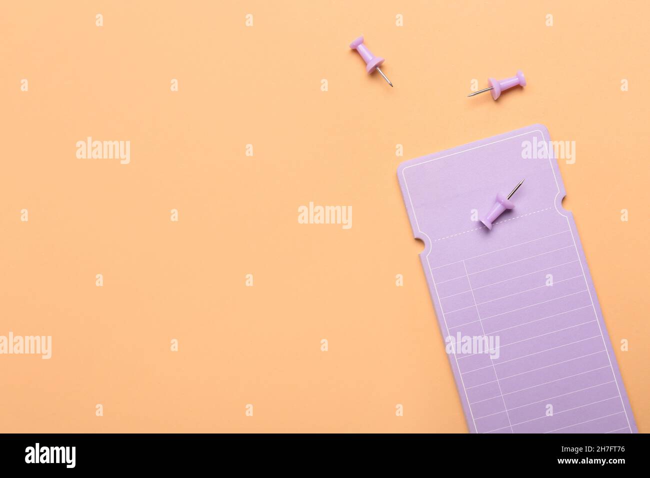 Sticky note papers and pins on color background Stock Photo - Alamy