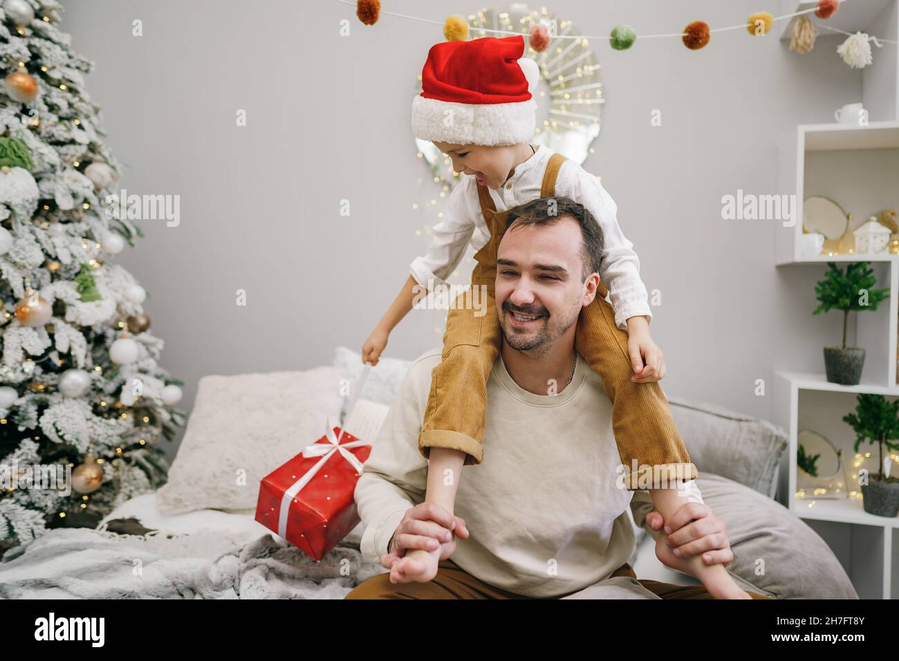 Young dad and his son celebrate christmas together Stock Photo - Alamy