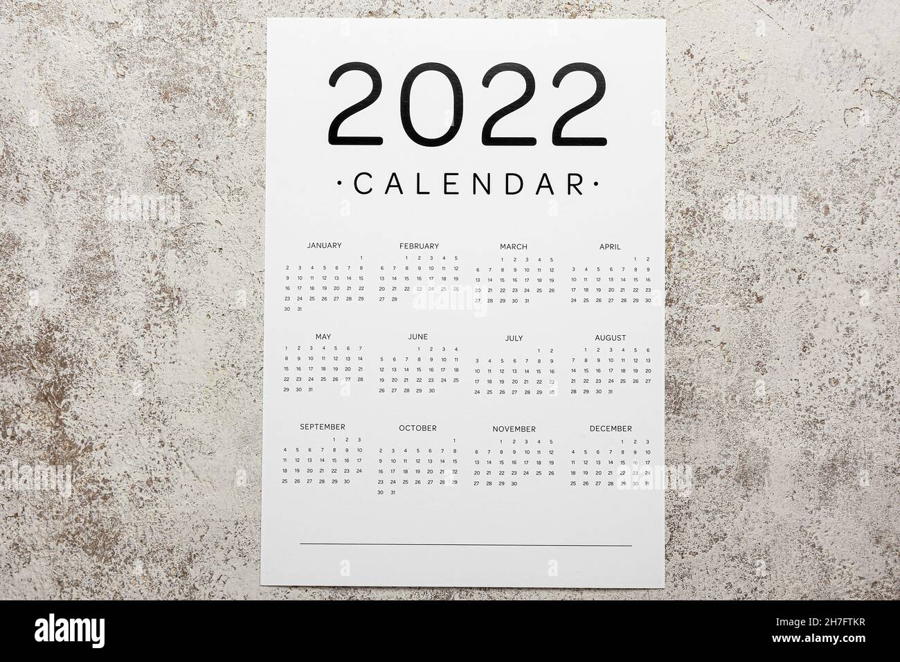 Paper calendar for year 2022 on grunge background Stock Photo - Alamy