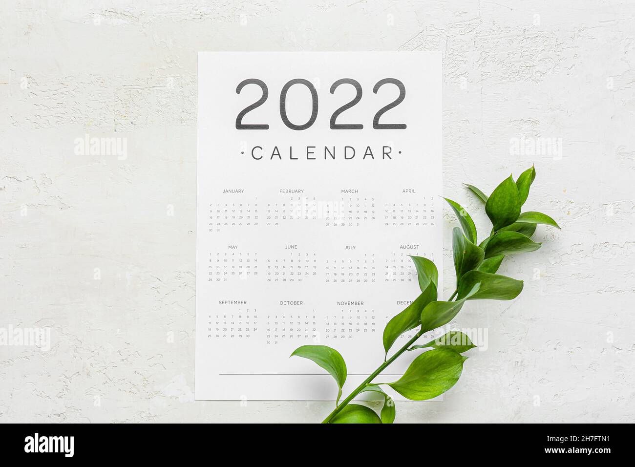 Paper calendar for year 2022 on white background Stock Photo - Alamy