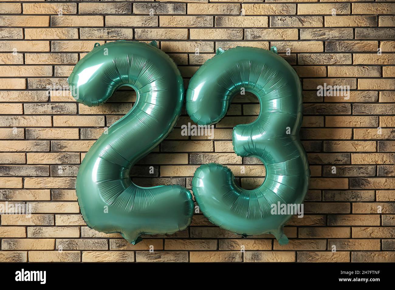 Number 23 made of balloons on brick background Stock Photo - Alamy