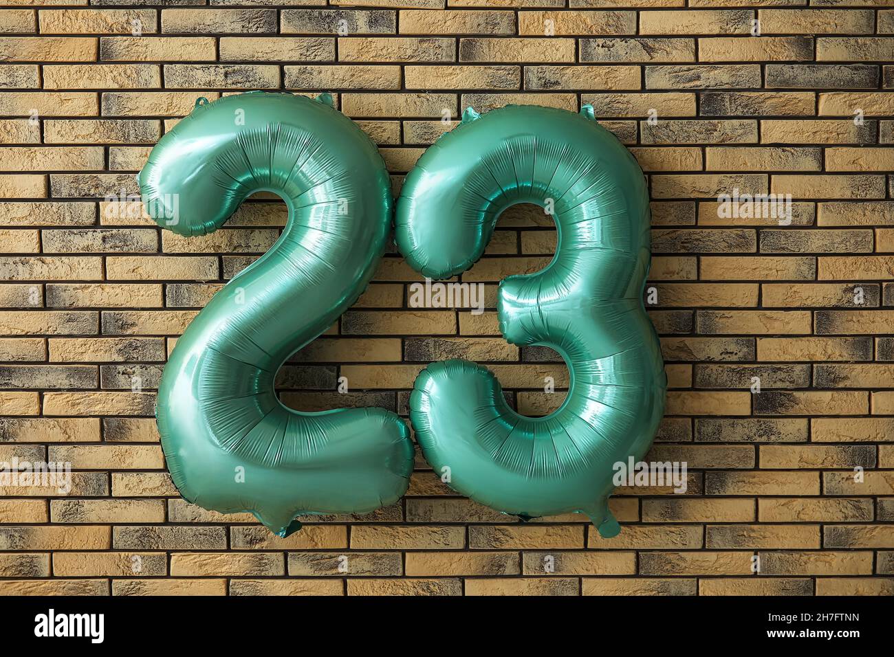 Number 23 made of balloons on brick background Stock Photo - Alamy