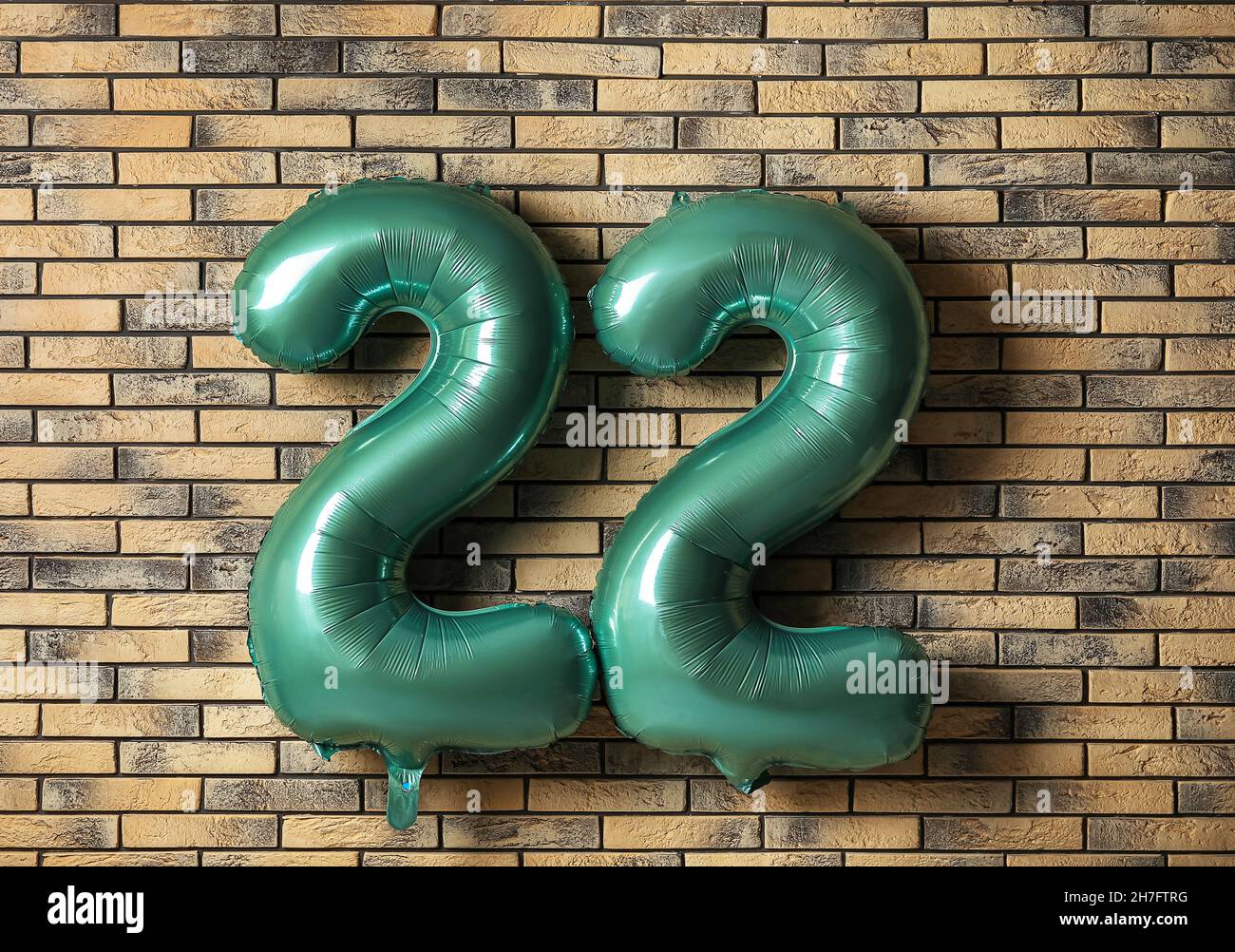 Number 22 made of balloons on brick background Stock Photo - Alamy
