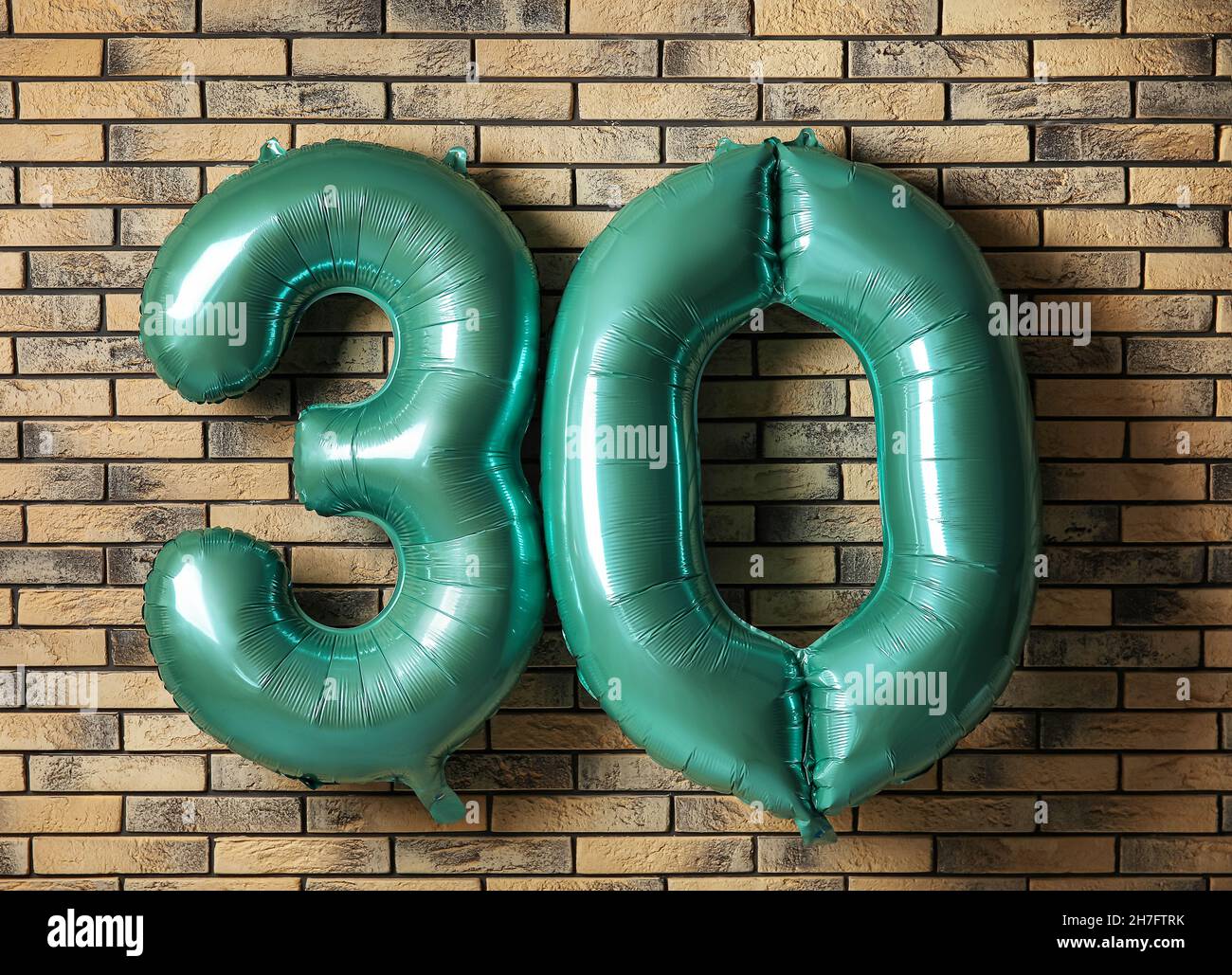 Number 30 made of balloons on brick background Stock Photo - Alamy