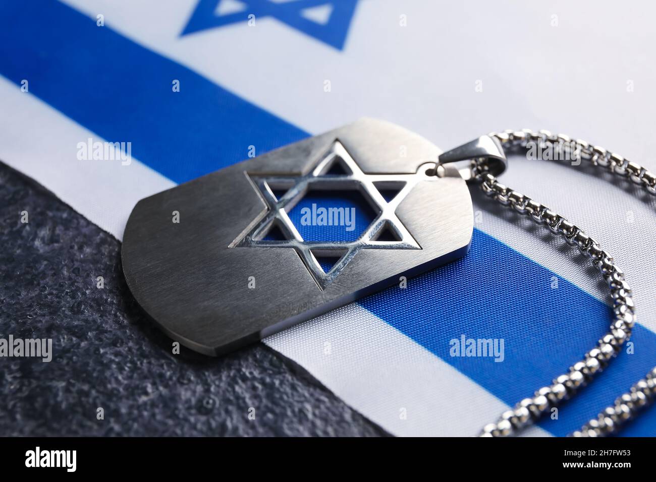 Military tag and flag of Israel on dark background, closeup Stock Photo ...