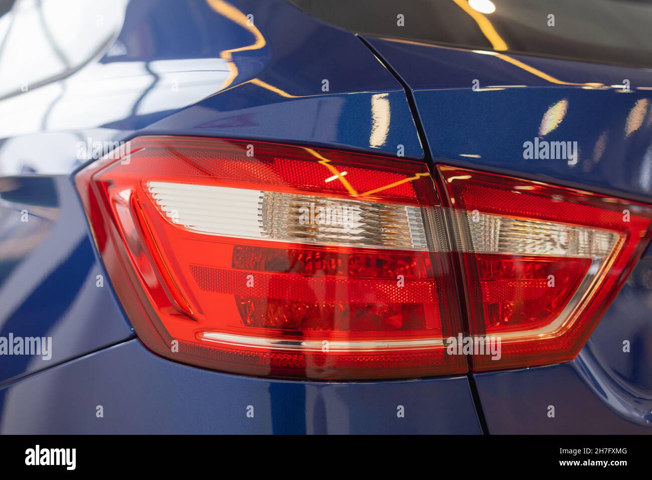 Blue car backlight close-up. Shiny new polished blue car paint Stock ...