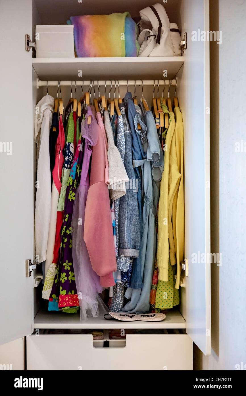 Wardrobe with perfect order clothes shades. Storage clothes. Teenager ...