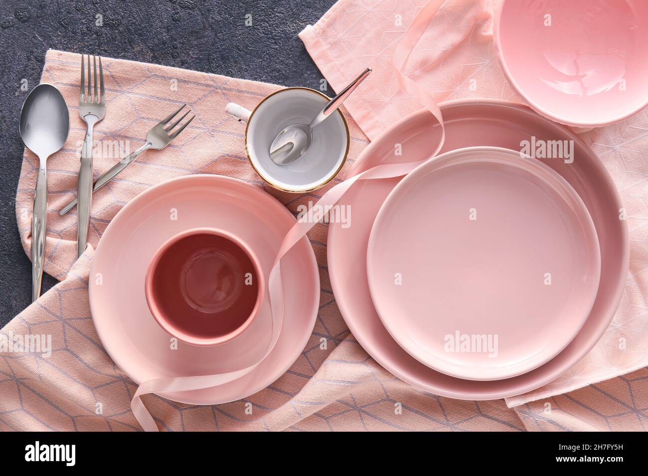 Set of stylish dinnerware on dark background Stock Photo - Alamy
