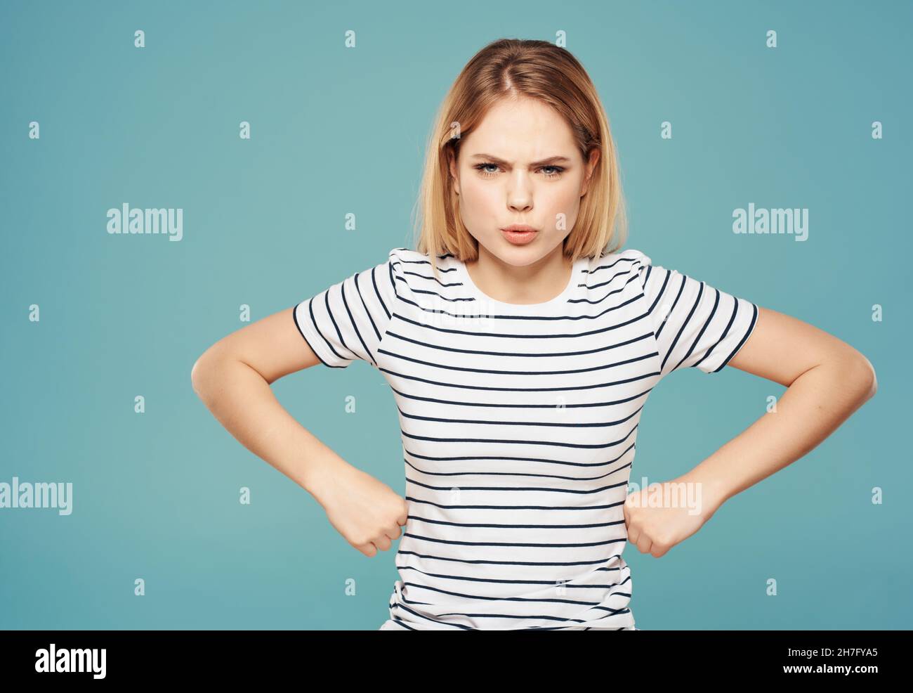 woman with serious expression displeased emotion blue background Stock ...