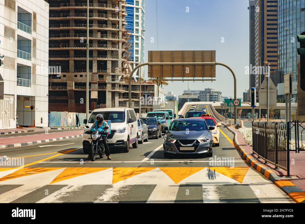Asphalt road with modern city skyline of Dubai Stock Photo - Alamy