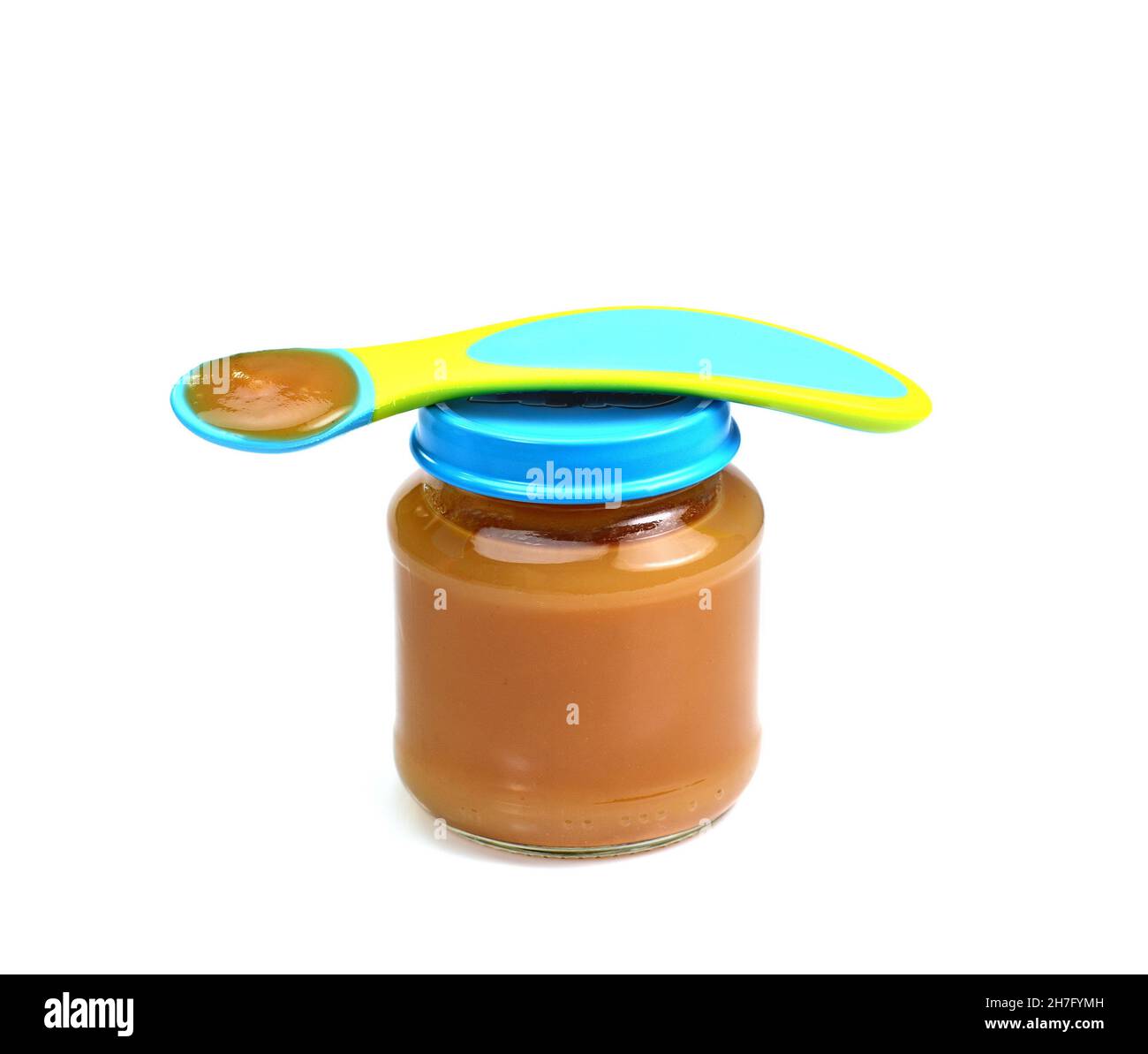 Baby fruit puree jar and spoon isolated on white Stock Photo - Alamy