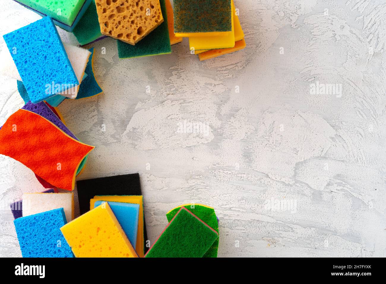 Pile of colorful cleaning sponges on gray background Stock Photo - Alamy