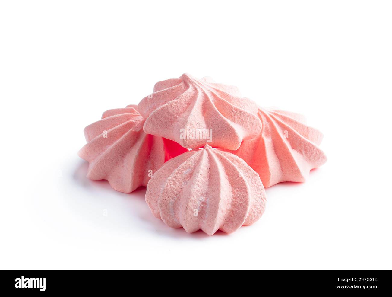 Pink meringue isolated on white background Stock Photo - Alamy