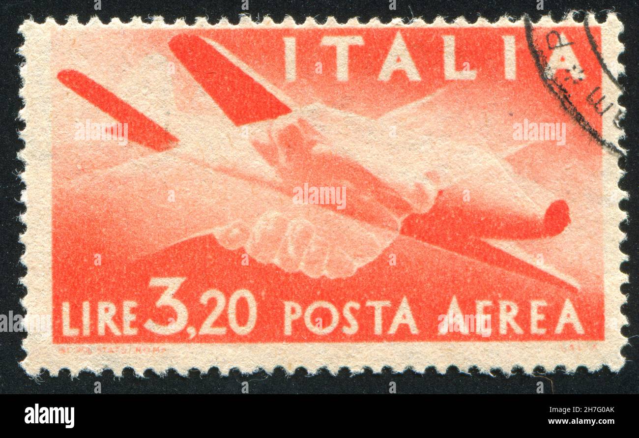 ITALY - CIRCA 1945: stamp printed by Italy, shows Plane and Clasped ...