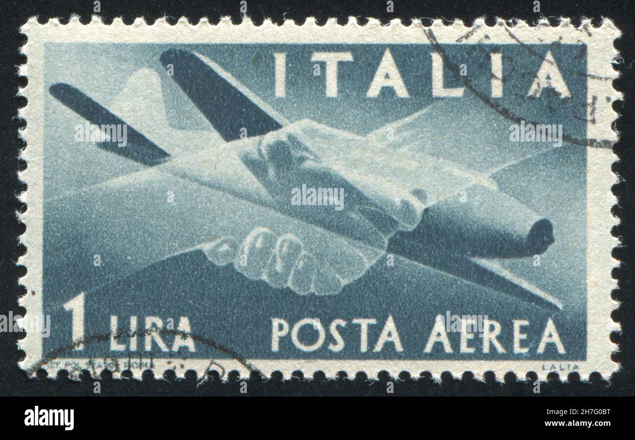 ITALY - CIRCA 1945: stamp printed by Italy, shows Plane and Clasped ...
