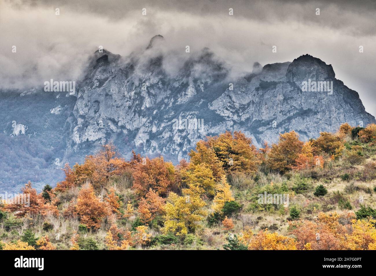 Fall in the French Pyrenees. Light evening clouds gather and mask the ...