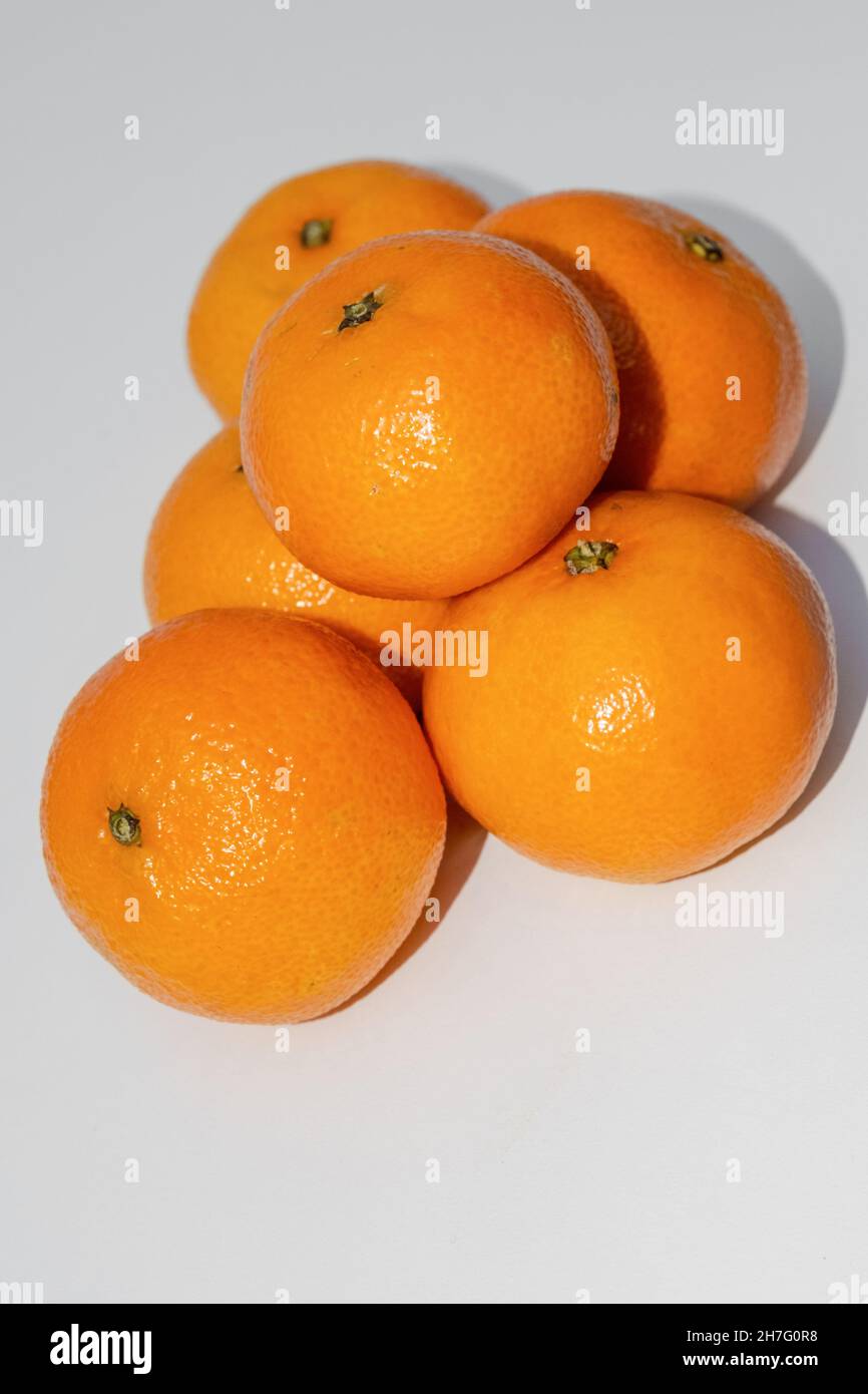 A Lot of Orange tangerines on the white background with flash Stock ...