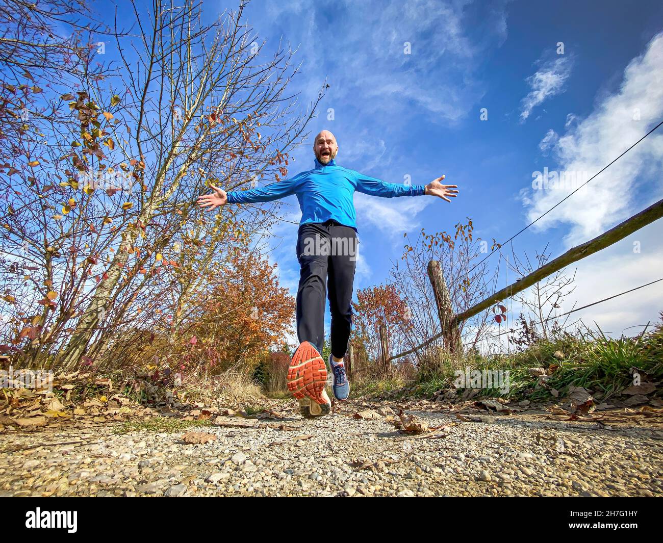 Running at the forest with Autumn Season background Stock Photo - Alamy
