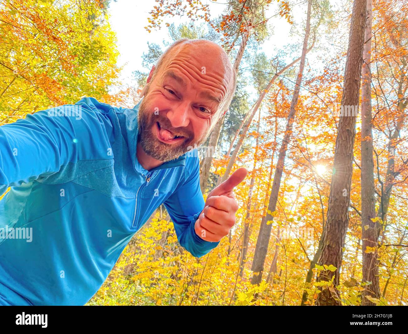 Running at the forest with Autumn Season background Stock Photo - Alamy