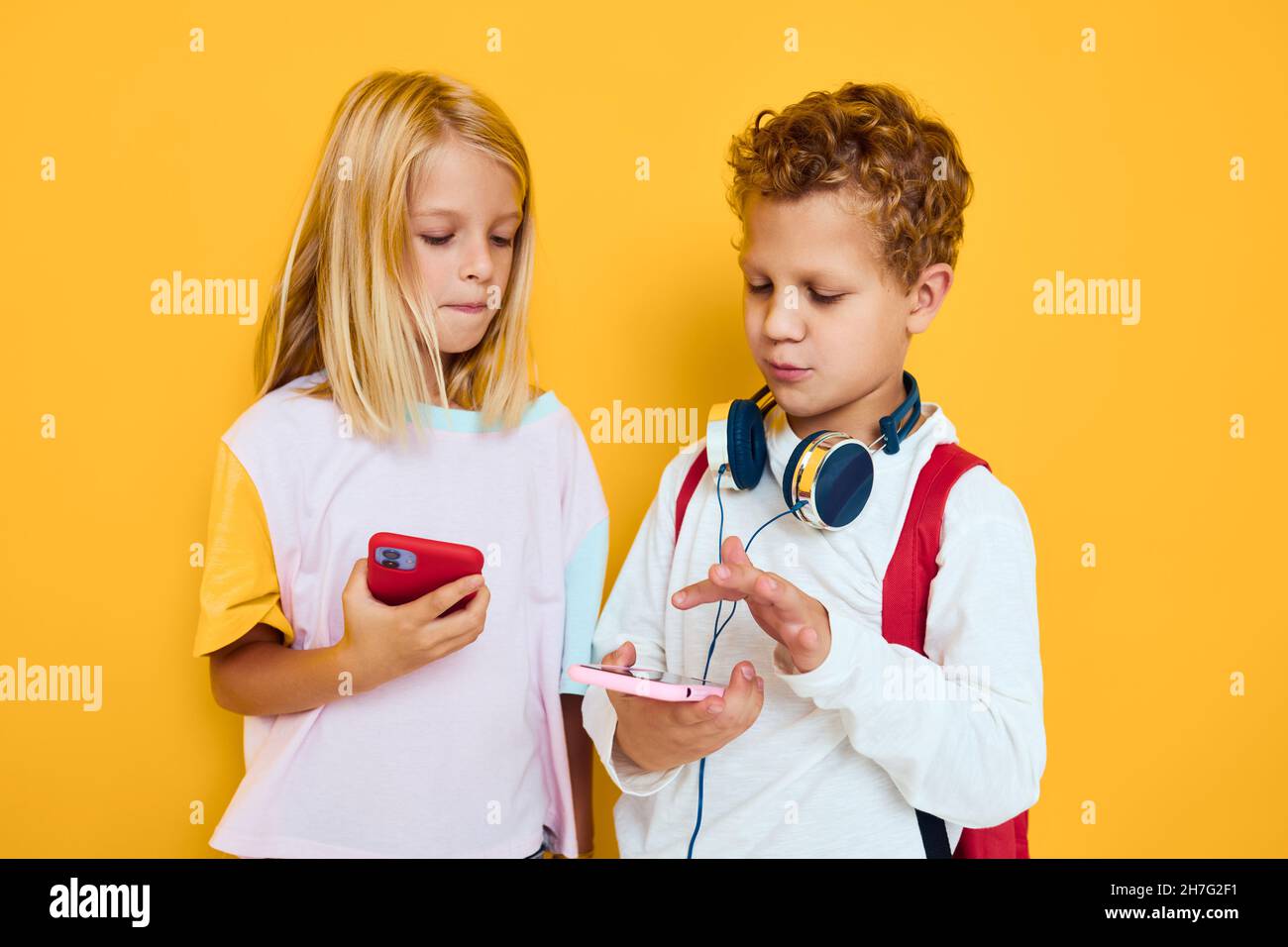 Photo of two small kids girl talking and smiling emotions joy isolated ...
