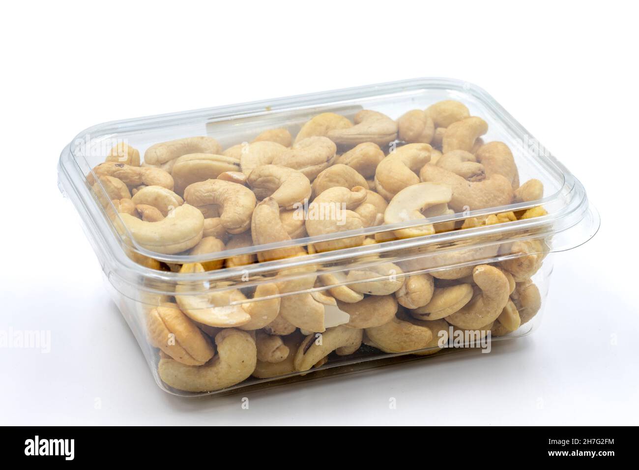 Packed cashews isolated on white background. Snack nuts. close-up Stock ...