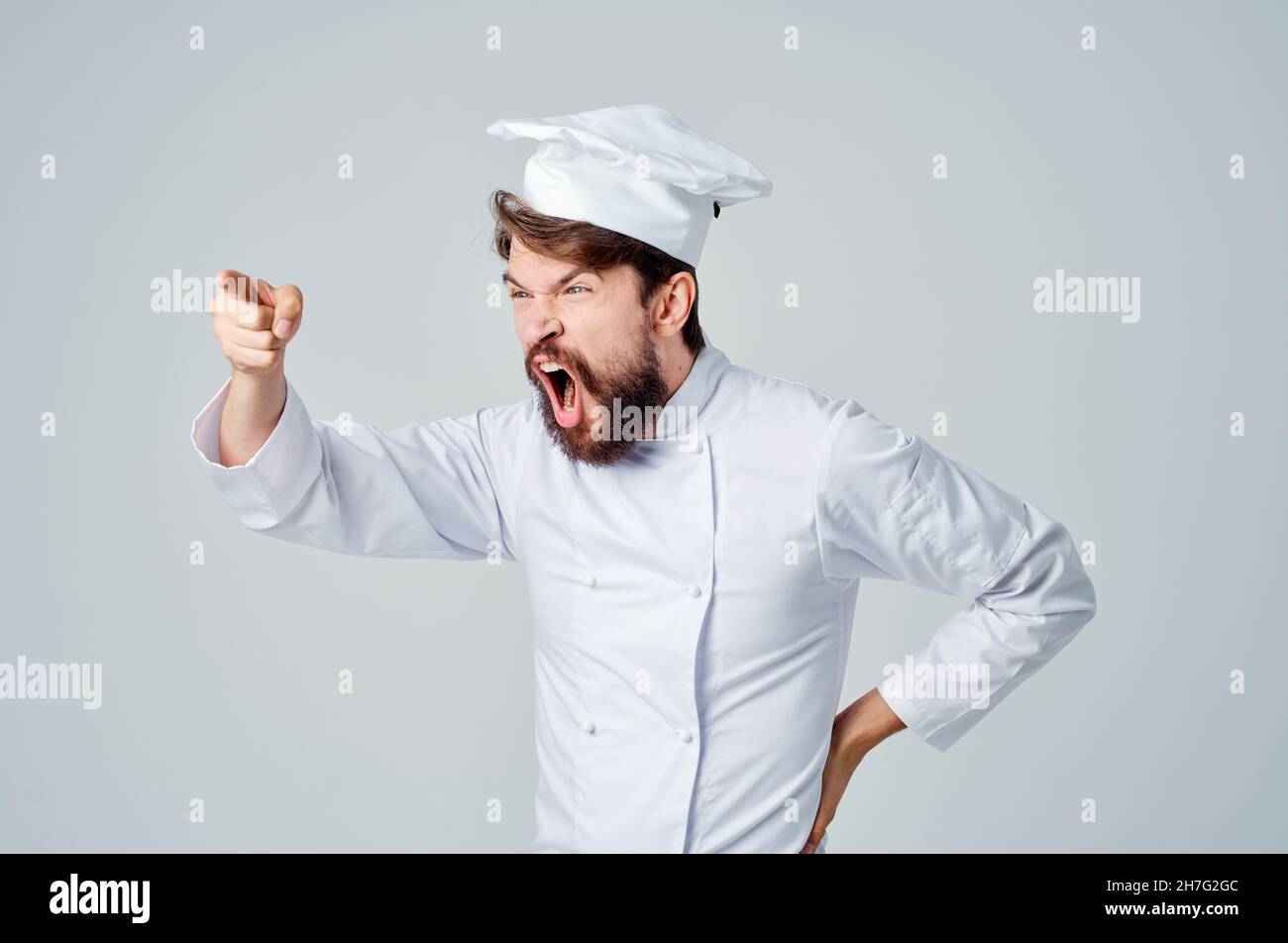 male cook work uniform profession kitchen posing studio Stock Photo - Alamy