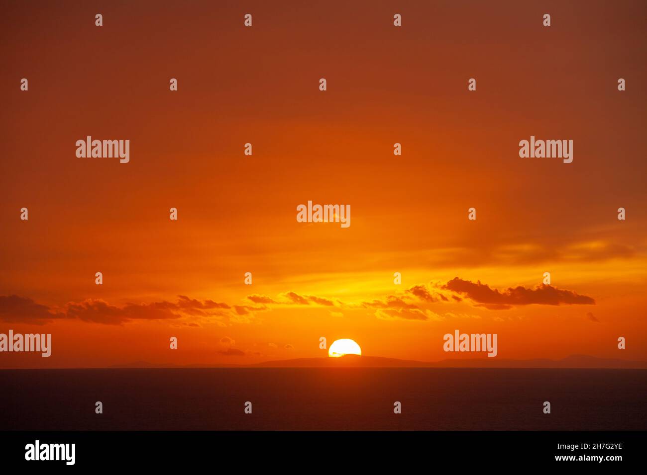 The sun setting over the sea from South Stack Lighthouse,Holy Island ...