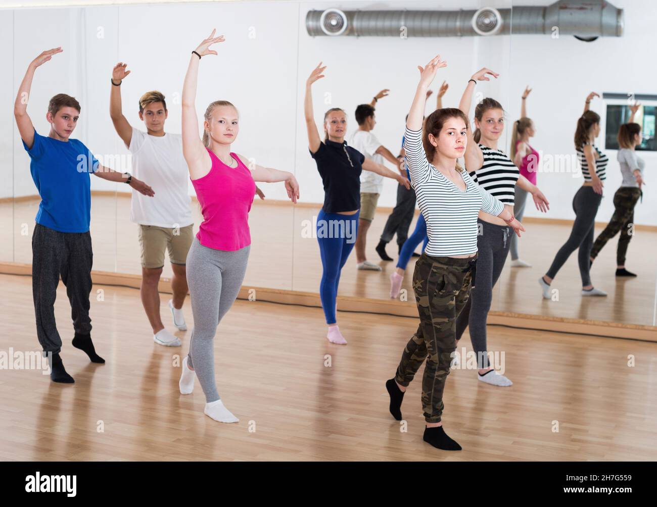 Dance teacher with students at dance studio Stock Photo - Alamy