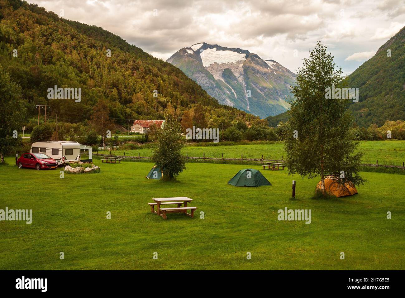 Camping with tents and a motorhome in the mountains of Norway Stock ...