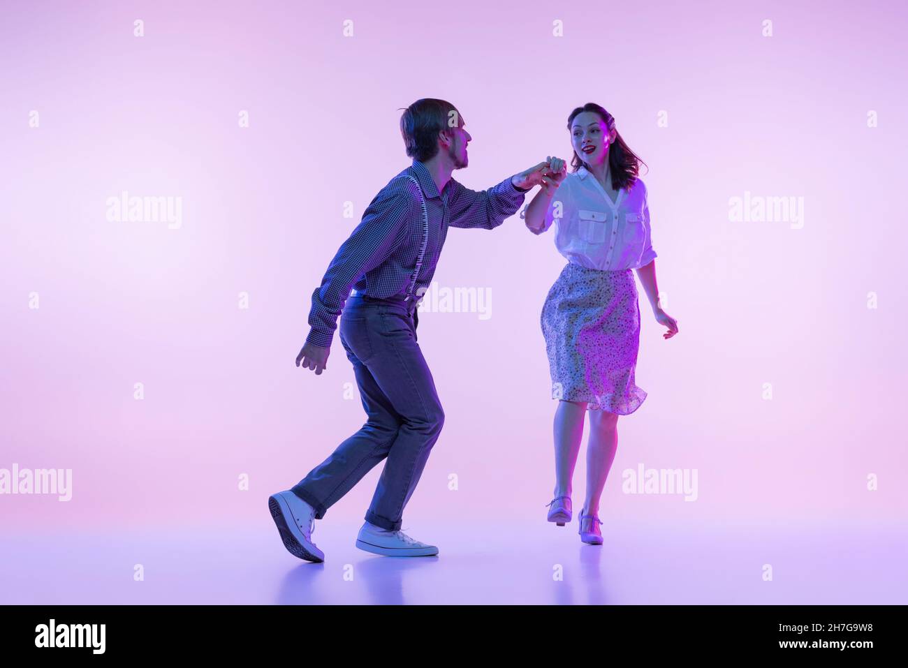 Couple of dancers, young man and woman in vintage retro style outfits ...