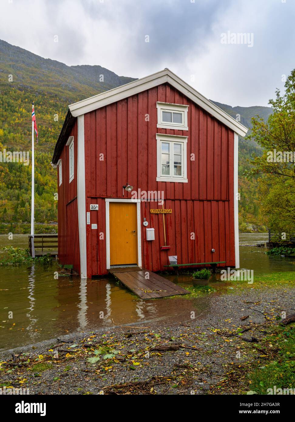 MOSJOEN, NORWAY - Mar 03, 2021: A vertical shot of a red wooden ...