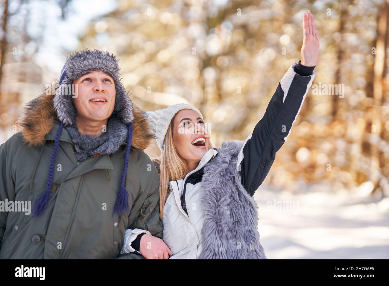 Couple having fun in winter scenery and snow Stock Photo - Alamy