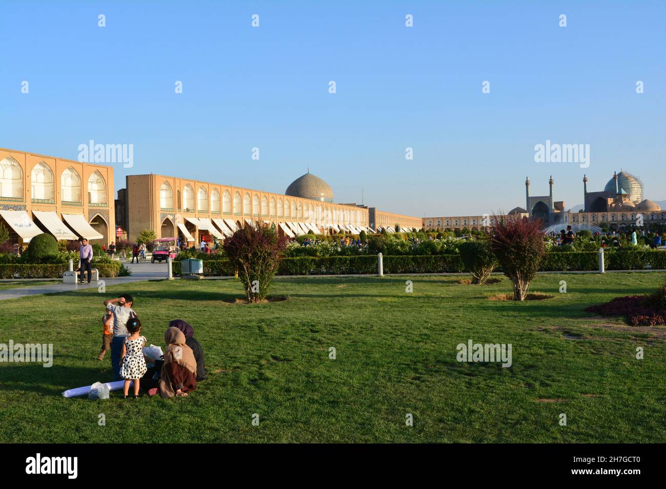 IRAN. ISPAHAN ESFAHAN. KIDS RIDING BICYCLE ON EMAM SQUARE, PART OF THE ...